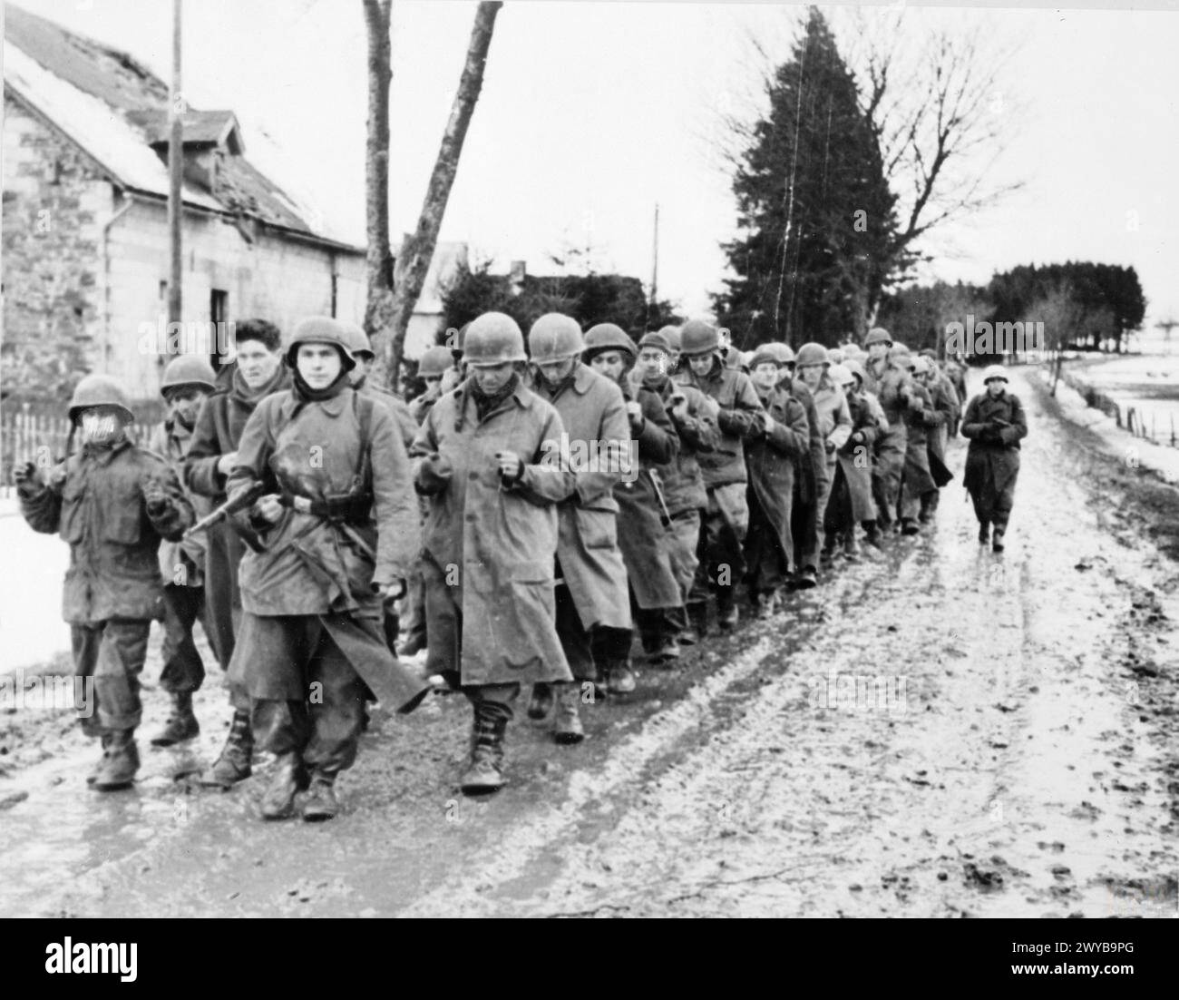 THE GERMAN OFFENSIVE IN THE ARDENNES, 1944 - American soldiers being ...