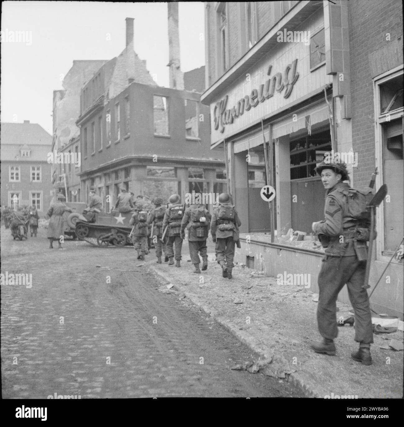 British infantry and carriers operate in the German town of Lingen on 6 ...