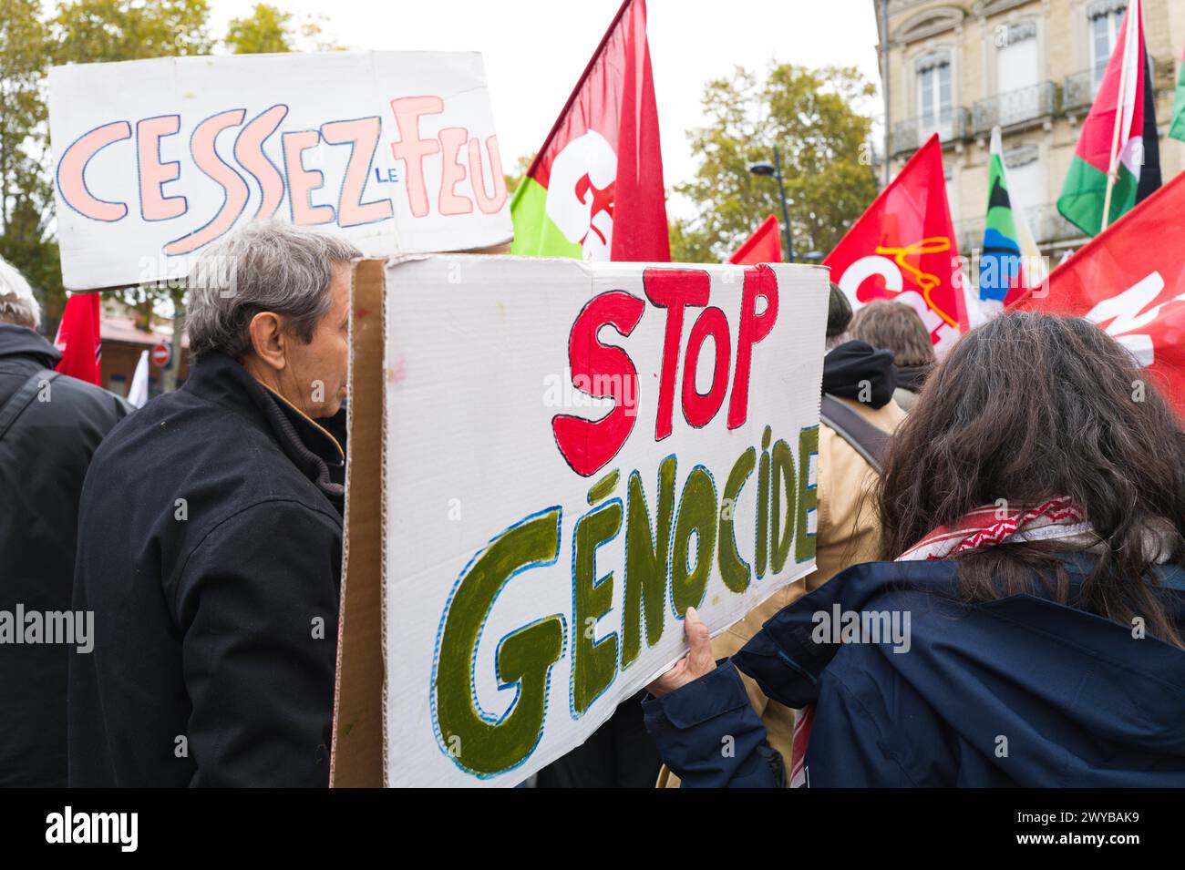 Two placards, Cease Fire and Stop Genocide. Demonstration for peace in ...