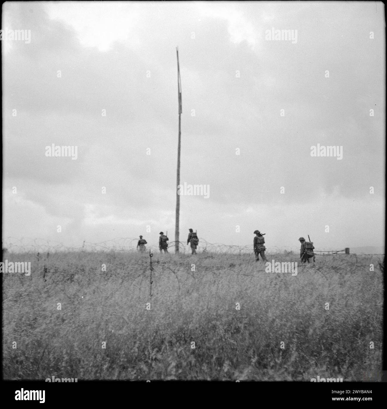 Troops of the Green Howards advance through minefields at dawn during ...