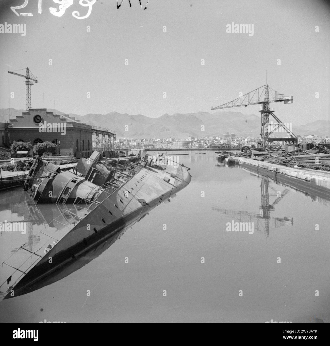Italian gunboat Geniere lies on its side in Palermo Harbour after bomb ...