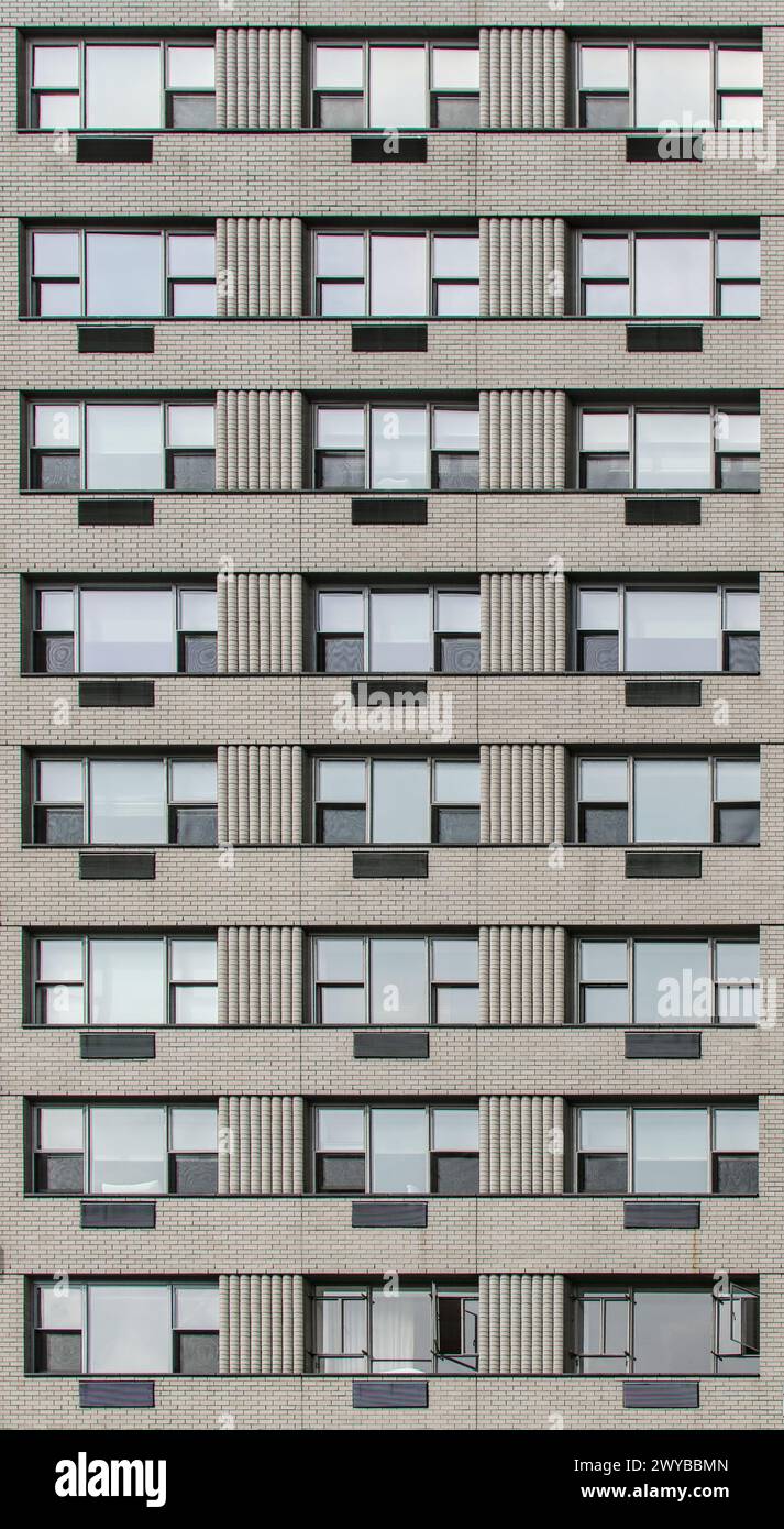 tall residential tower with balconies and windows (detail of top of ...