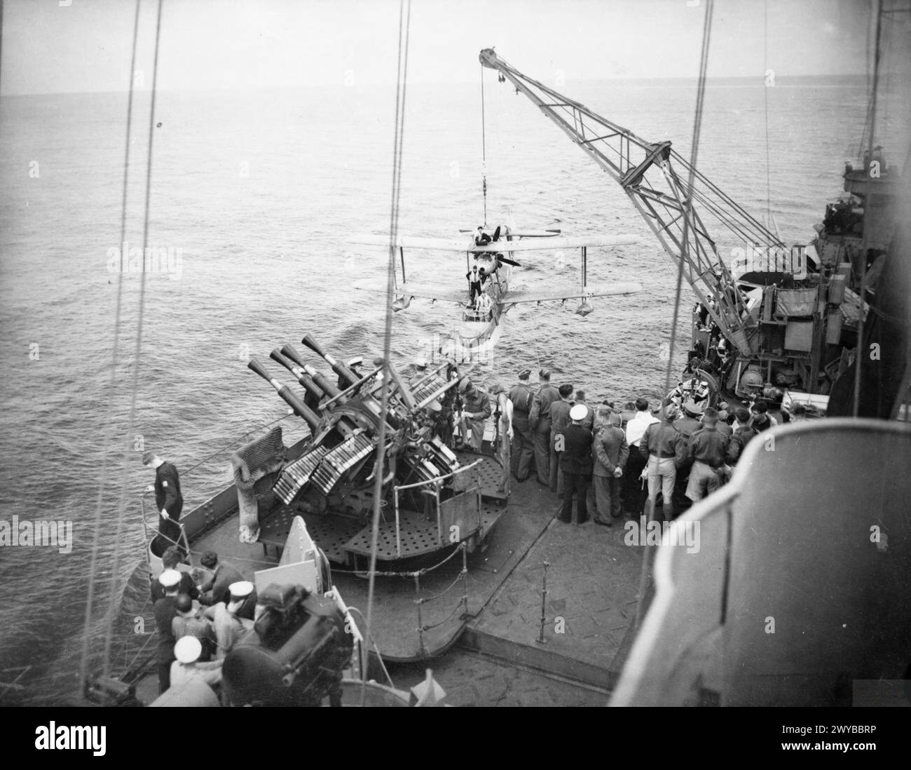 ON BOARD THE CRUISER HMS SHEFFIELD. MAY 1941, AT SEA. - A Supermarine Walrus Amphibian being ...