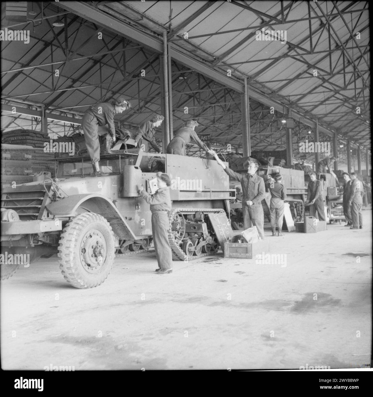 ATS women are servicing White half-tracks at a vehicle reserve depot in ...