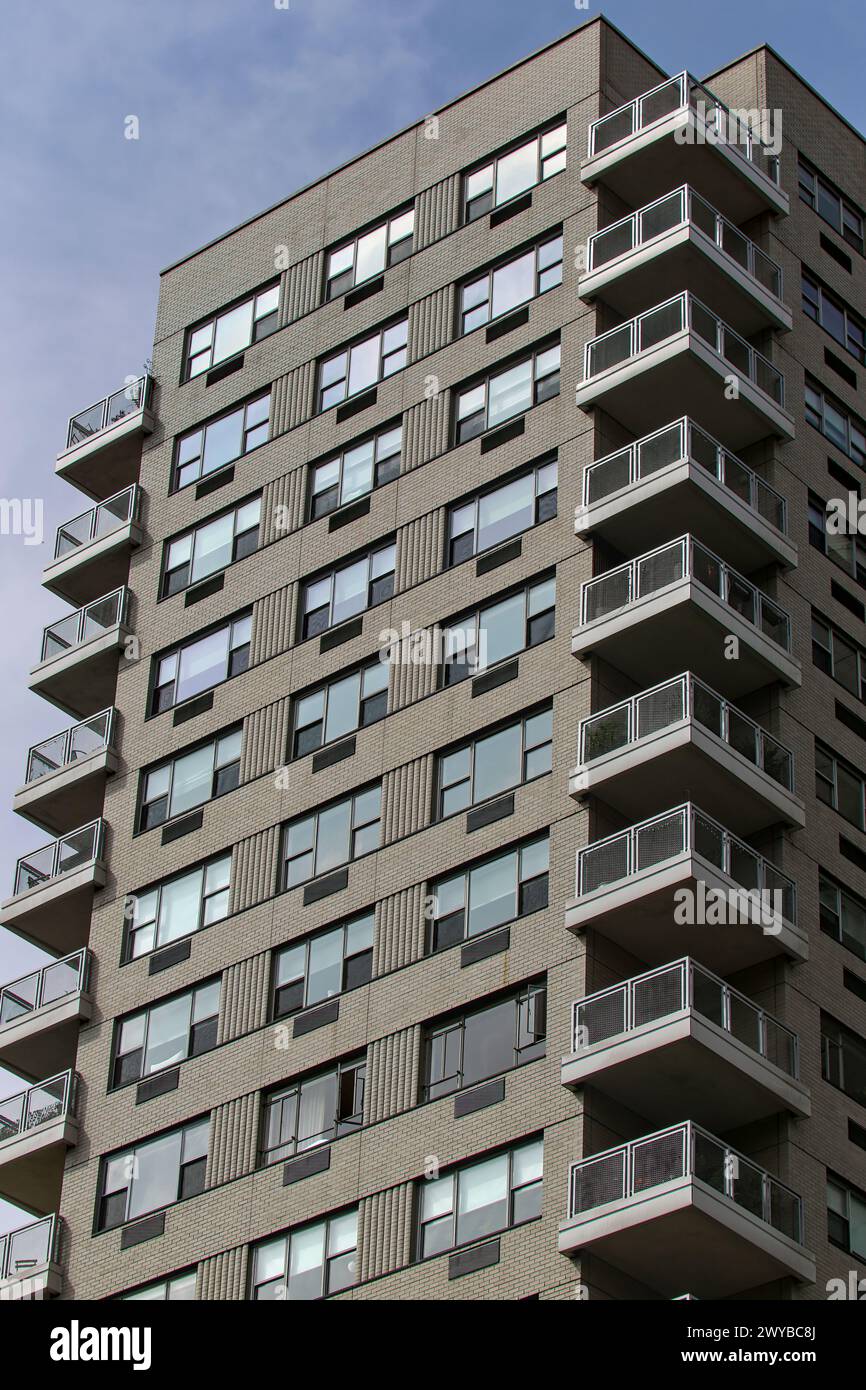 tall residential tower with balconies and windows (detail of top of ...