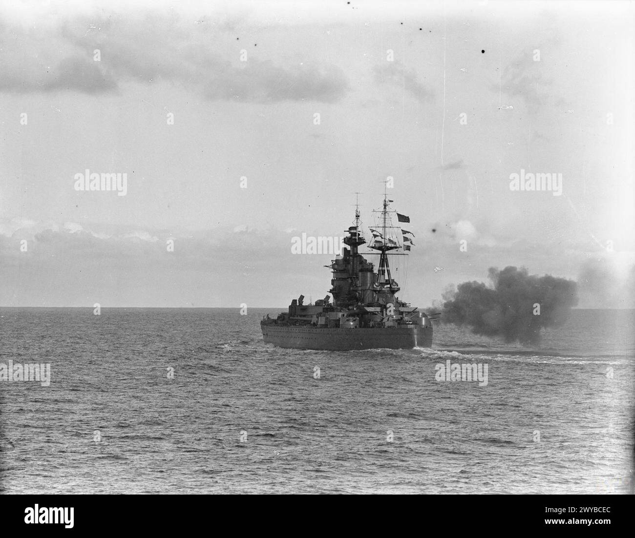 ON BOARD THE BATTLESHIP HMS RODNEY AT SEA. 1940. - HMS NELSON firing ...