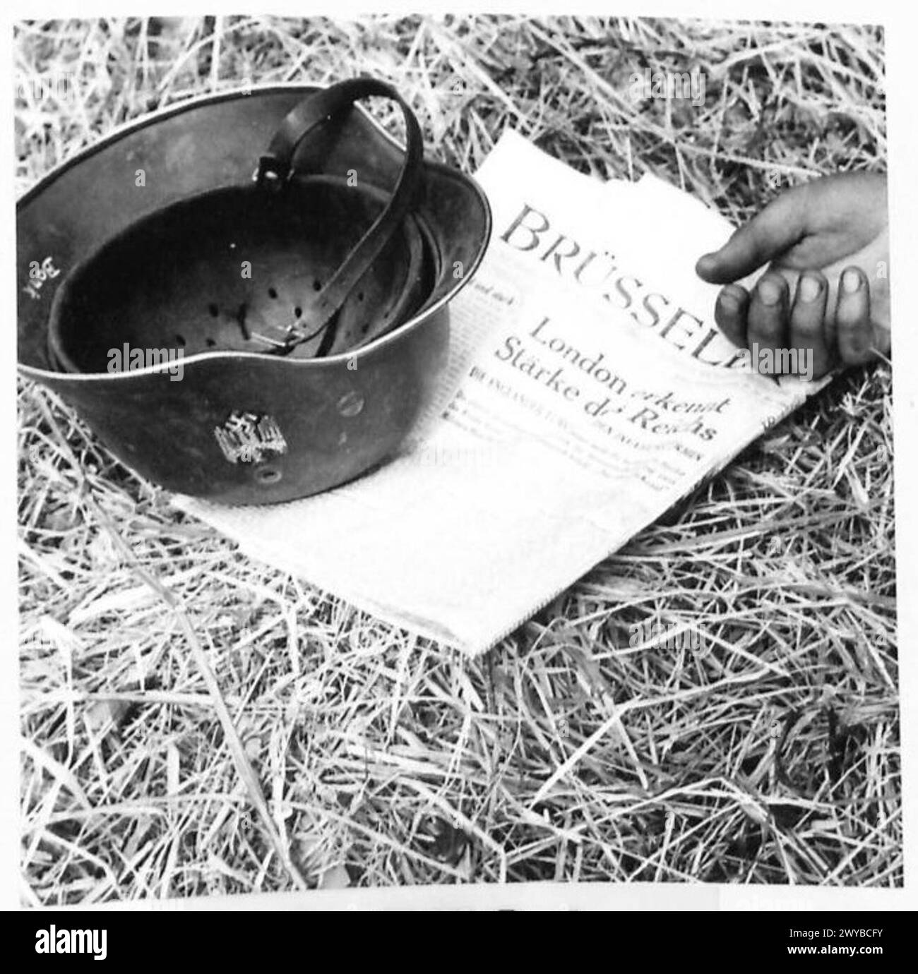 A captured German helmet and the Brussler Zeitung newspaper dated 20/21 ...