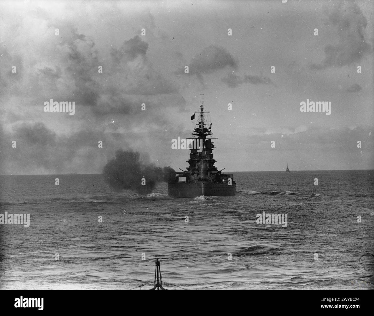 ON BOARD THE BATTLESHIP HMS RODNEY AT SEA. 1940. - HMS NELSON firing ...