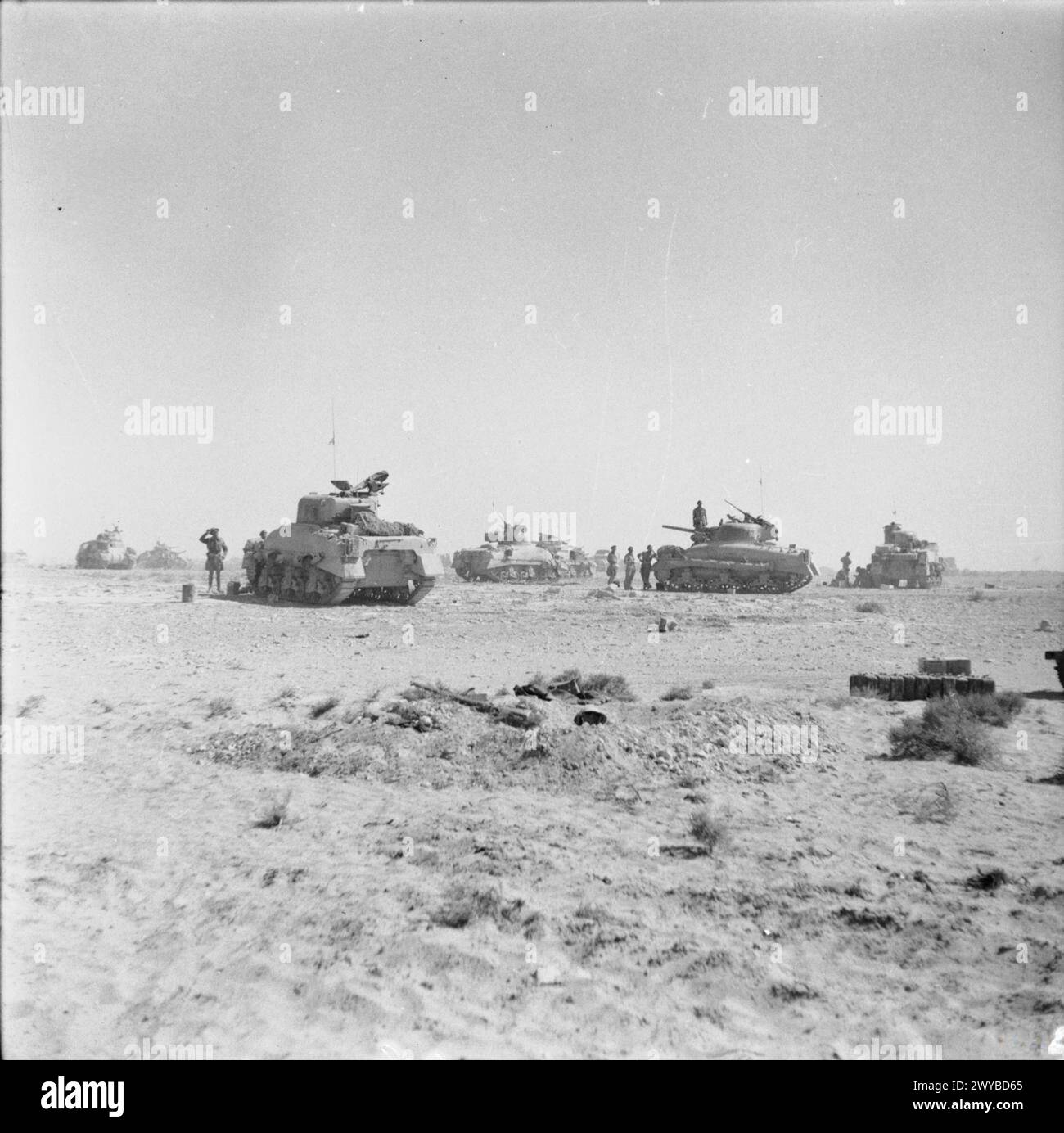 Sherman tanks of the 8th Armoured Brigade positioned behind forward ...