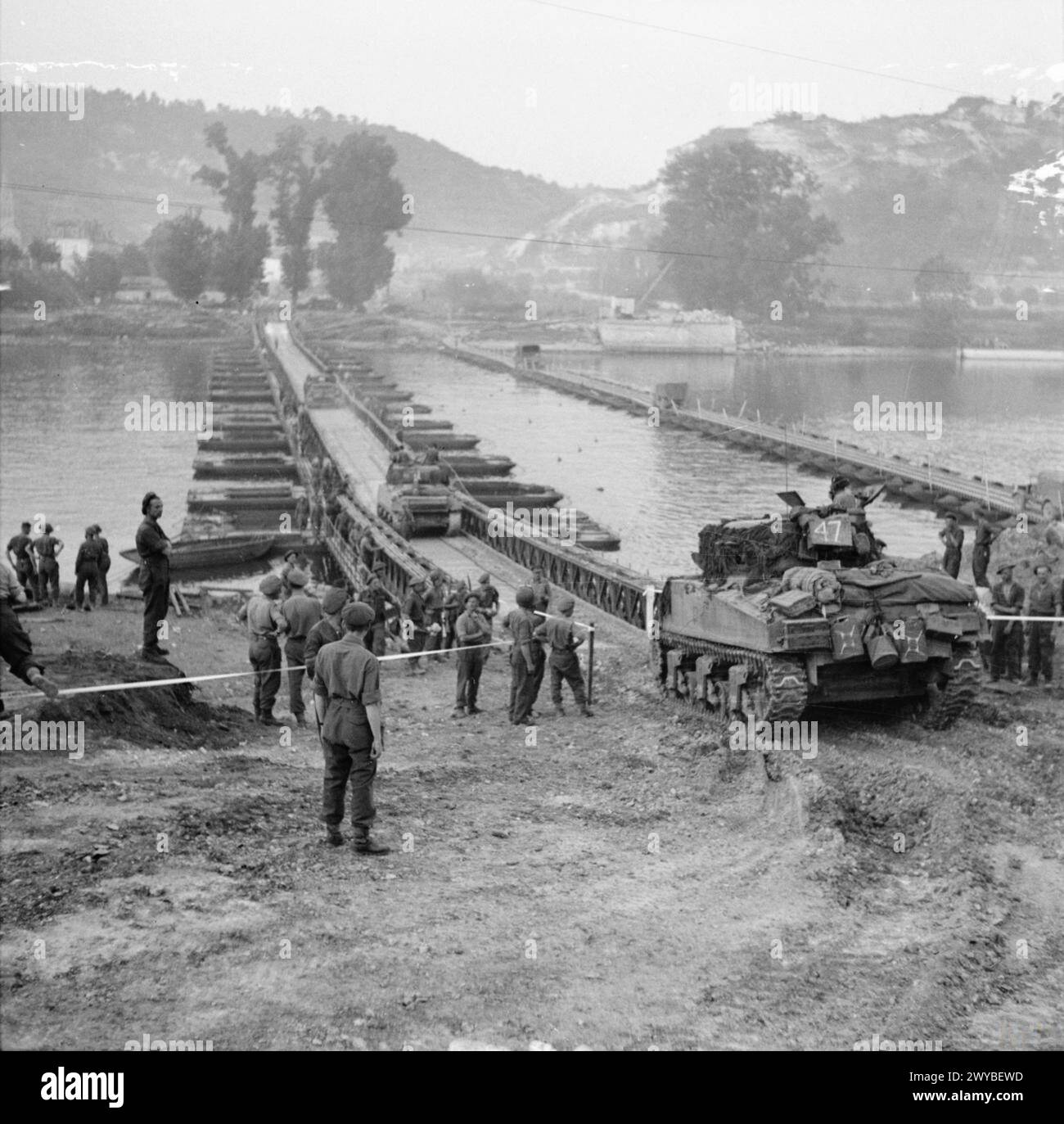 Sherman tanks cross a pontoon bridge over the River Seine at Vernon on ...
