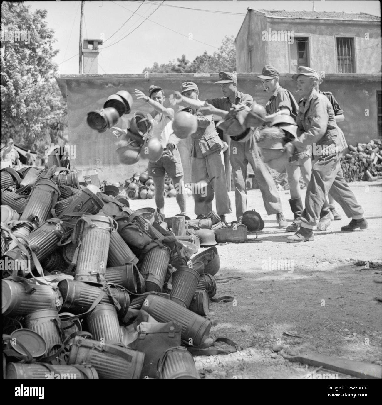 German troops on Rhodes surrendering in 1945, handing over gas masks ...
