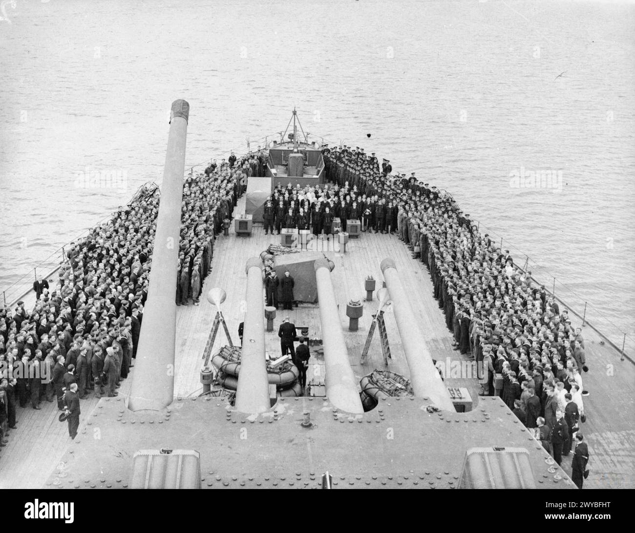 In April 1941, Captain J C Leach of HMS Prince of Wales reads the ...