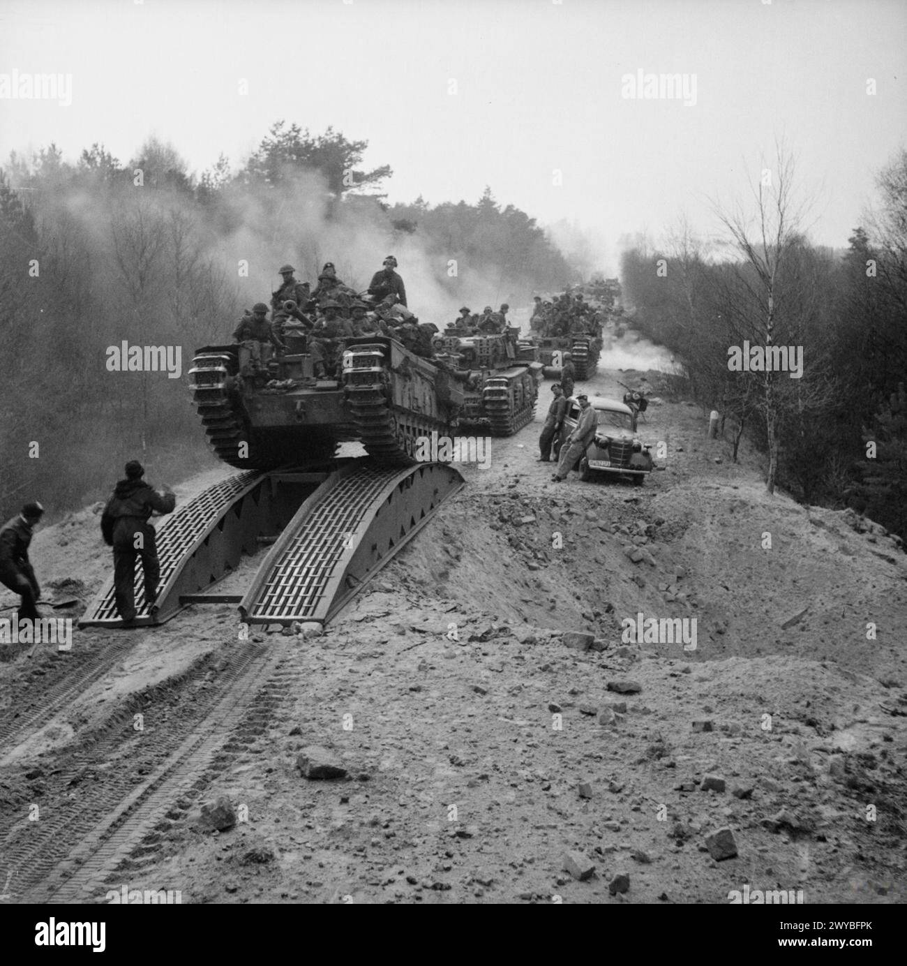 Churchill tanks of the 3rd Scots Guards, 6th Guards Tank Brigade, cross ...