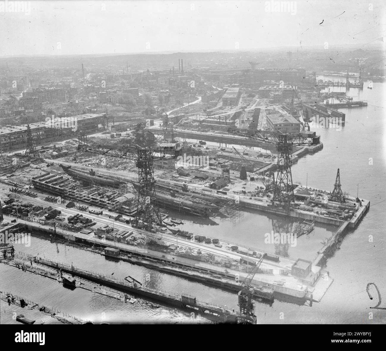 Low-level oblique aerial photograph shows German U-Boats on slipways of ...