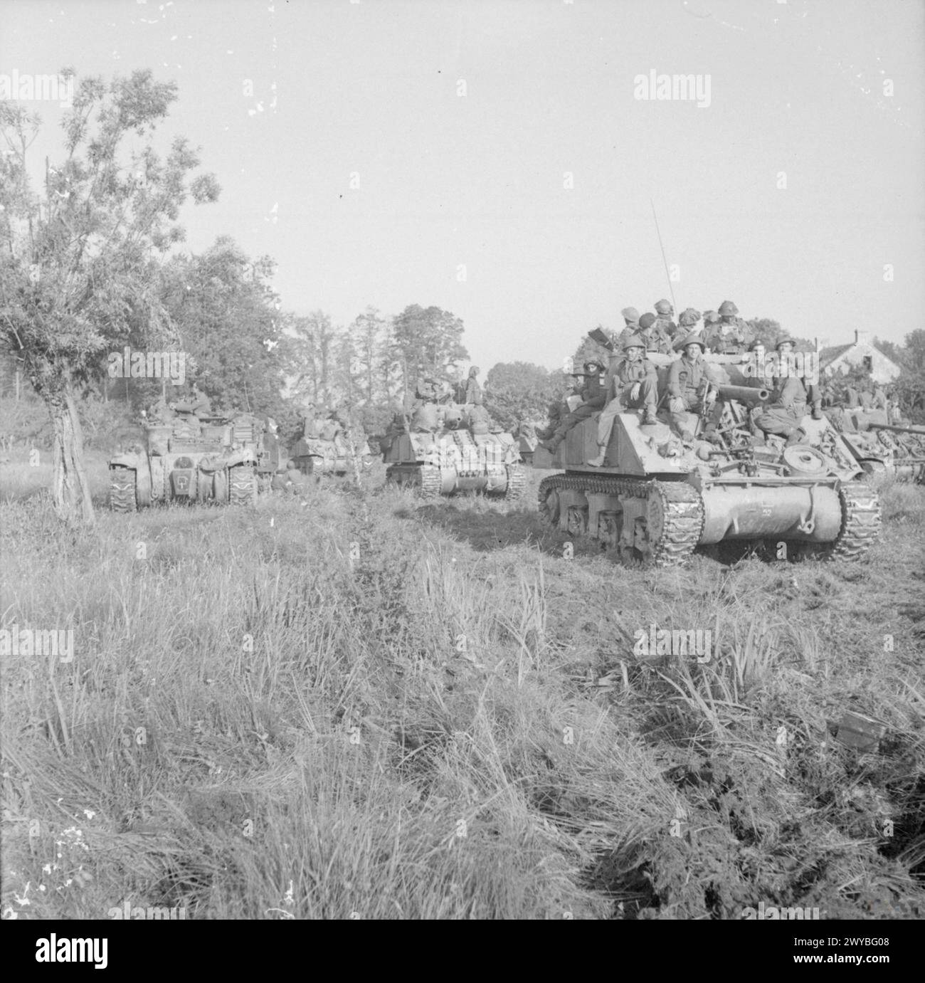THE BRITISH ARMY IN NORMANDY 1944 - Sherman tanks carrying infantry ...