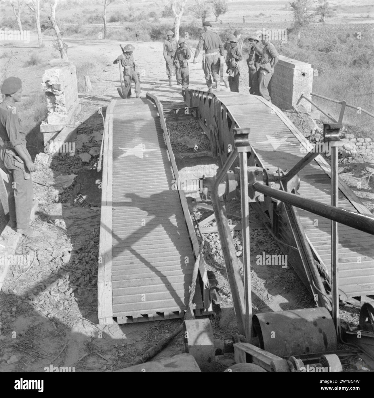 THE BRITISH ARMY IN BURMA 1945 - A scissors bridge laid down over a ...
