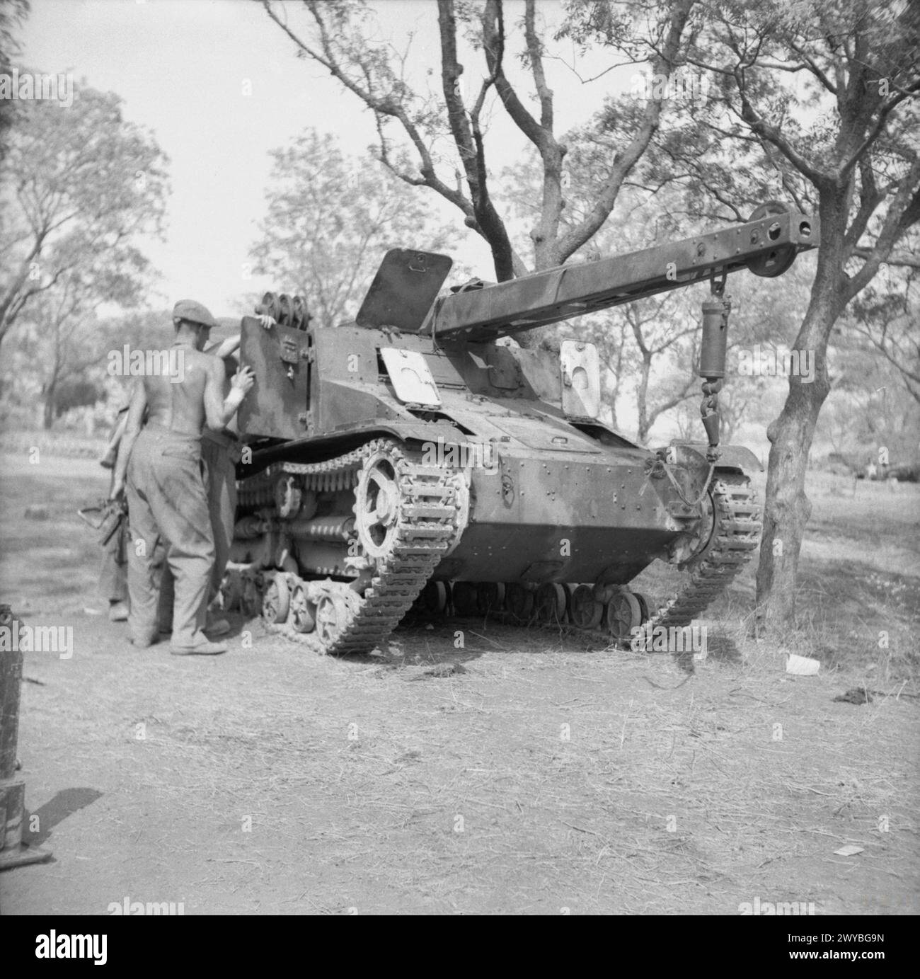 A soldier of the 17th Indian Division inspects a captured Japanese ...