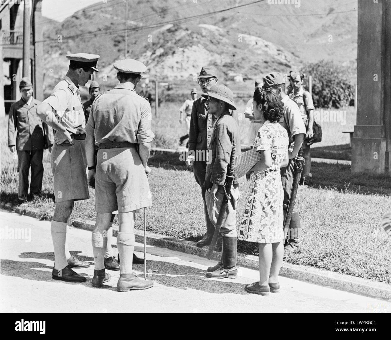 Commander T. Jamieson RN of HMS Indomitable directs Japanese officers ...