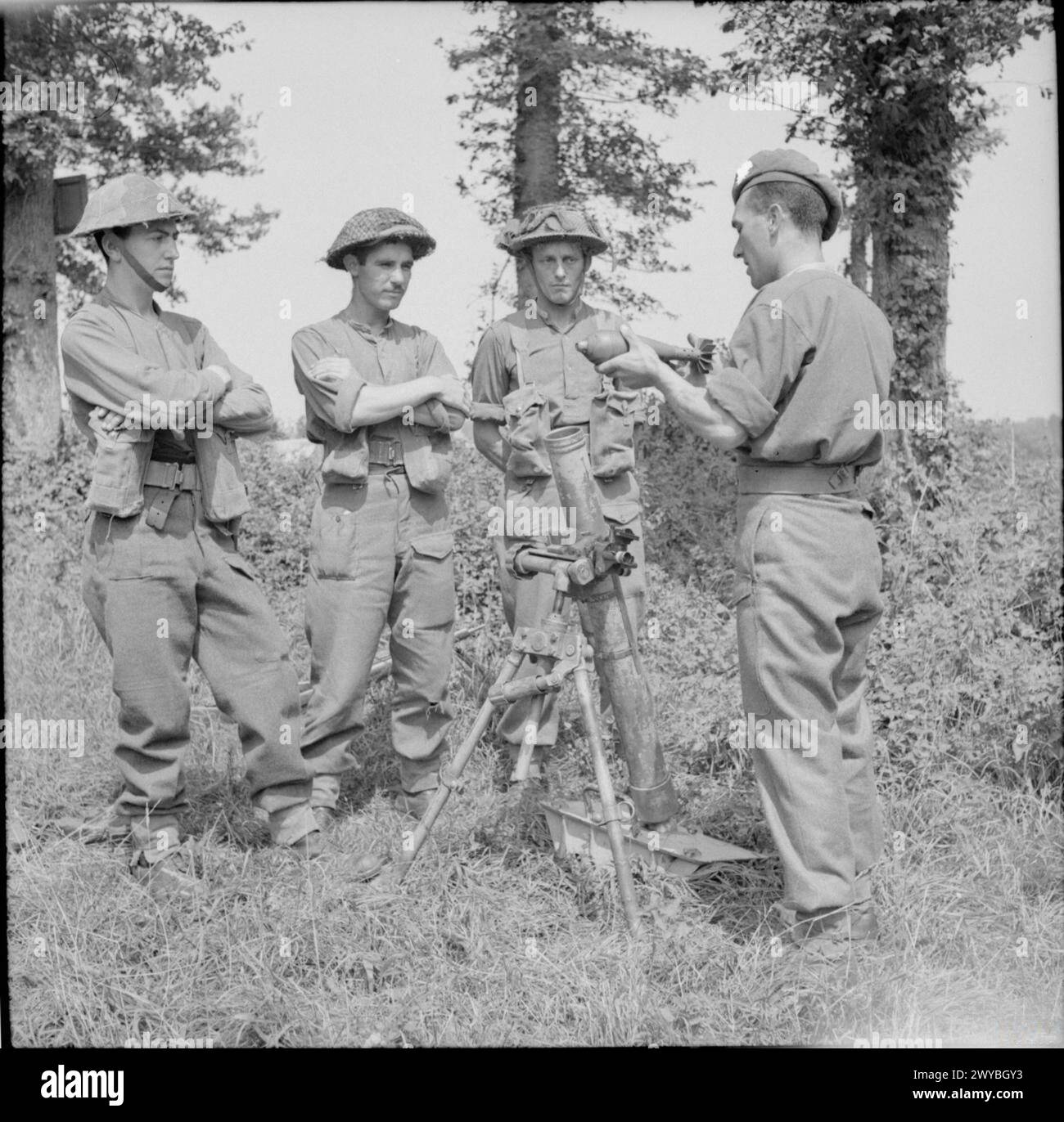 THE BRITISH ARMY IN NORMANDY 1944 - An instructor demonstrates the ...