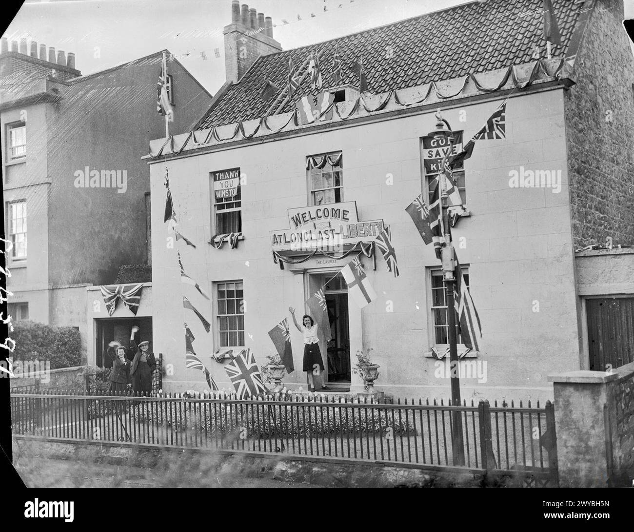 A house in St Peter Port, Guernsey is decorated with flags and banners ...