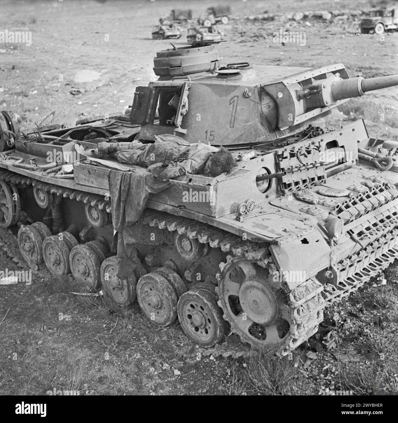 A German PzKpfw III tank destroyed in Tunisia with the body of a crew ...