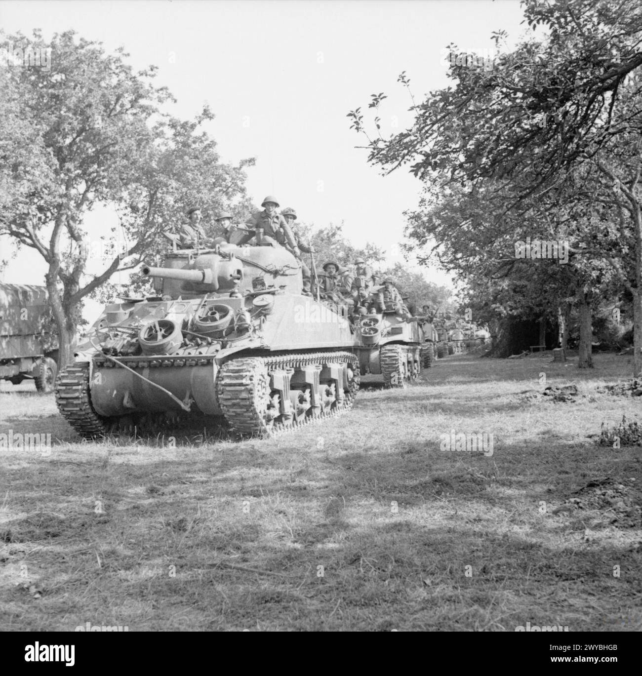 Sherman tanks of Staffordshire Yeomanry, 27th Armoured Brigade, carry ...