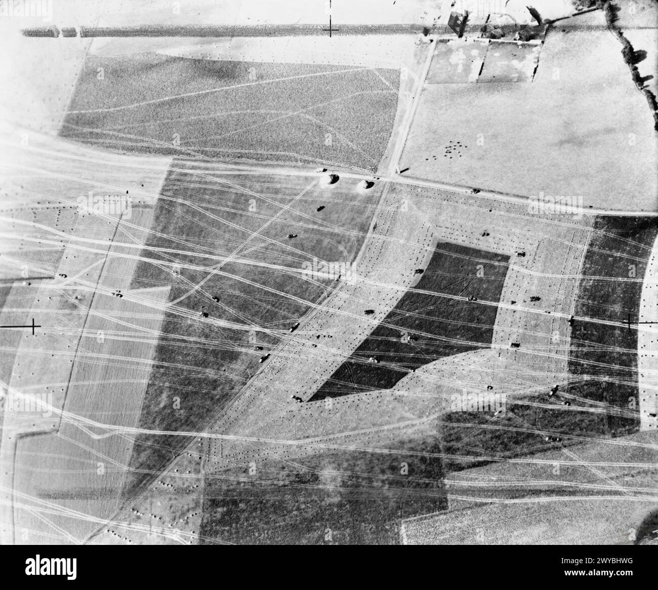 An oblique aerial reconnaissance photograph shows German vehicles ...