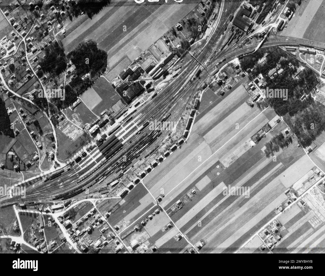 A vertical aerial photograph shows the railway station and marshalling ...