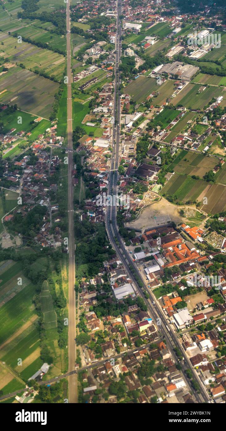 Aerial view of rural scenery with railroad tracks parallel to the ...