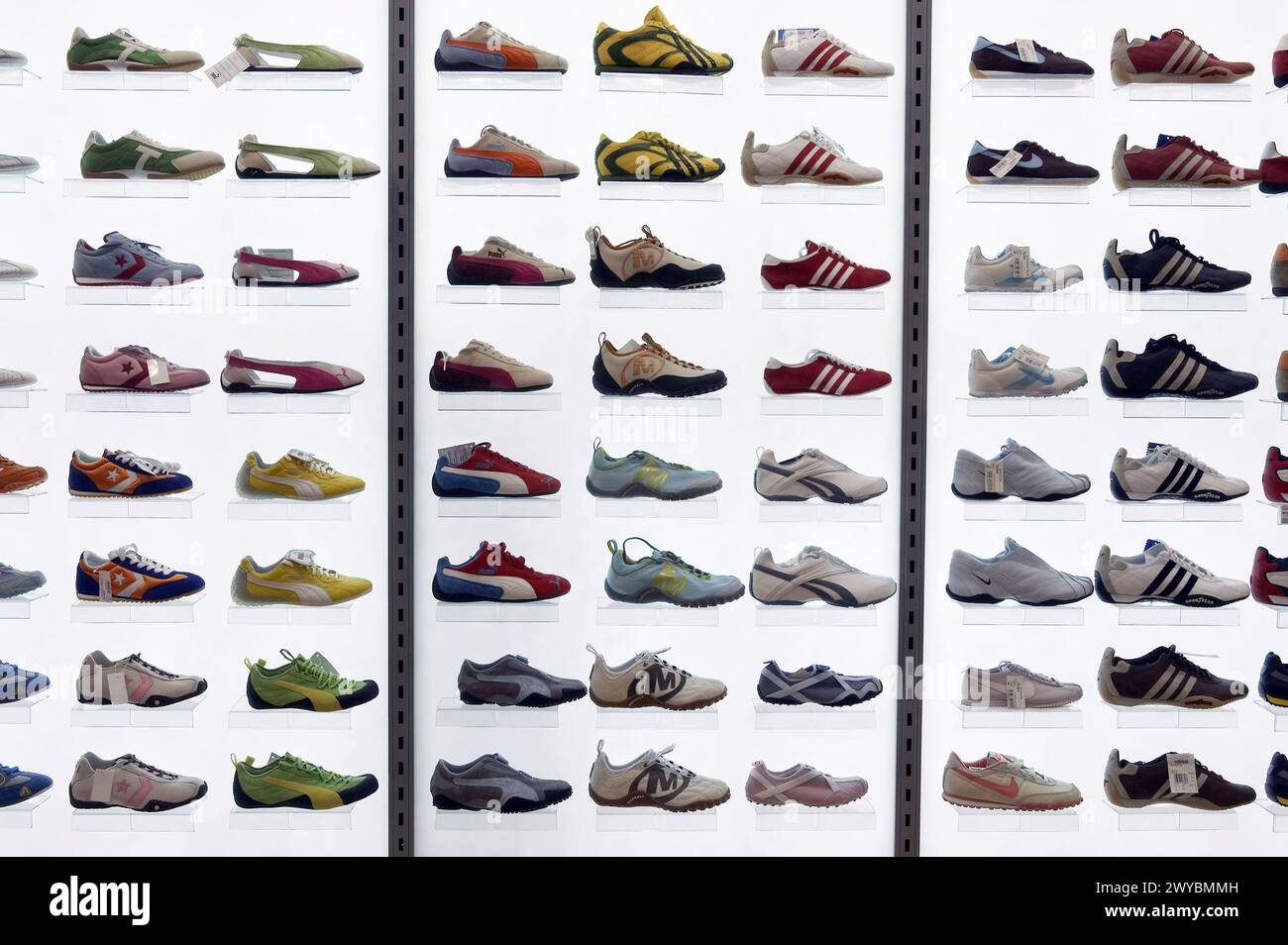 Sports shoes in shoe shop, shopping mall Stock Photo - Alamy