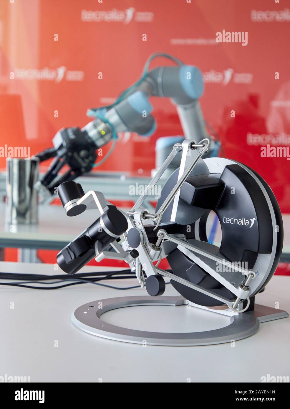 Robot composed of two pieces, a robotic arm, motorized by a clamp to ...