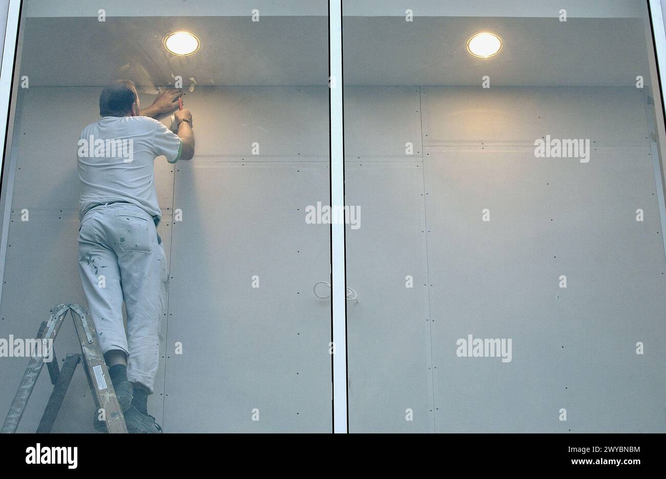 Painter in shop window. Amsterdam, Netherlands Stock Photo - Alamy