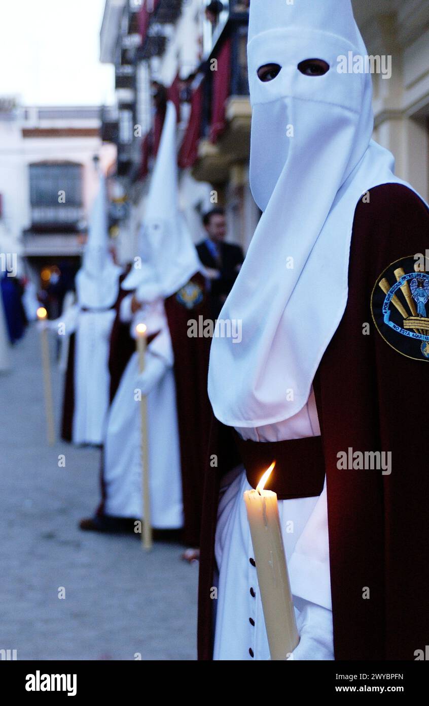 Hermandad del Santo Entierro penitents at procession during Holy Week ...