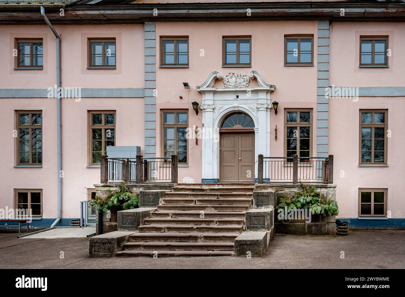Entrance to building. Entrance group in mansion and shabby facade ...