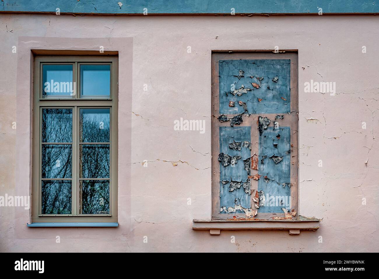 Architectural detail of a window and painted fake window next to it ...
