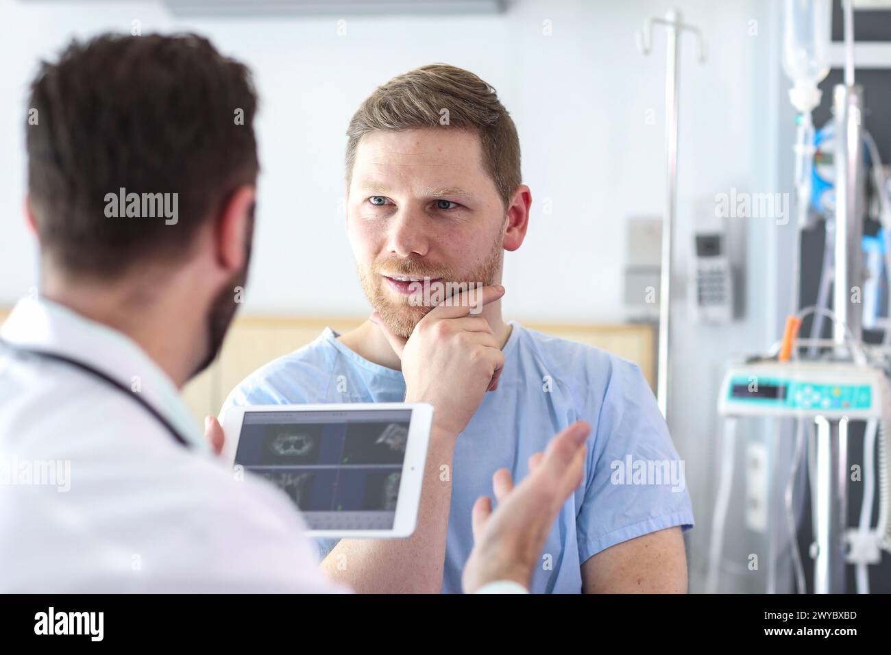 Patient in hospital room attended by a doctor, Tablet, Hospital Stock ...