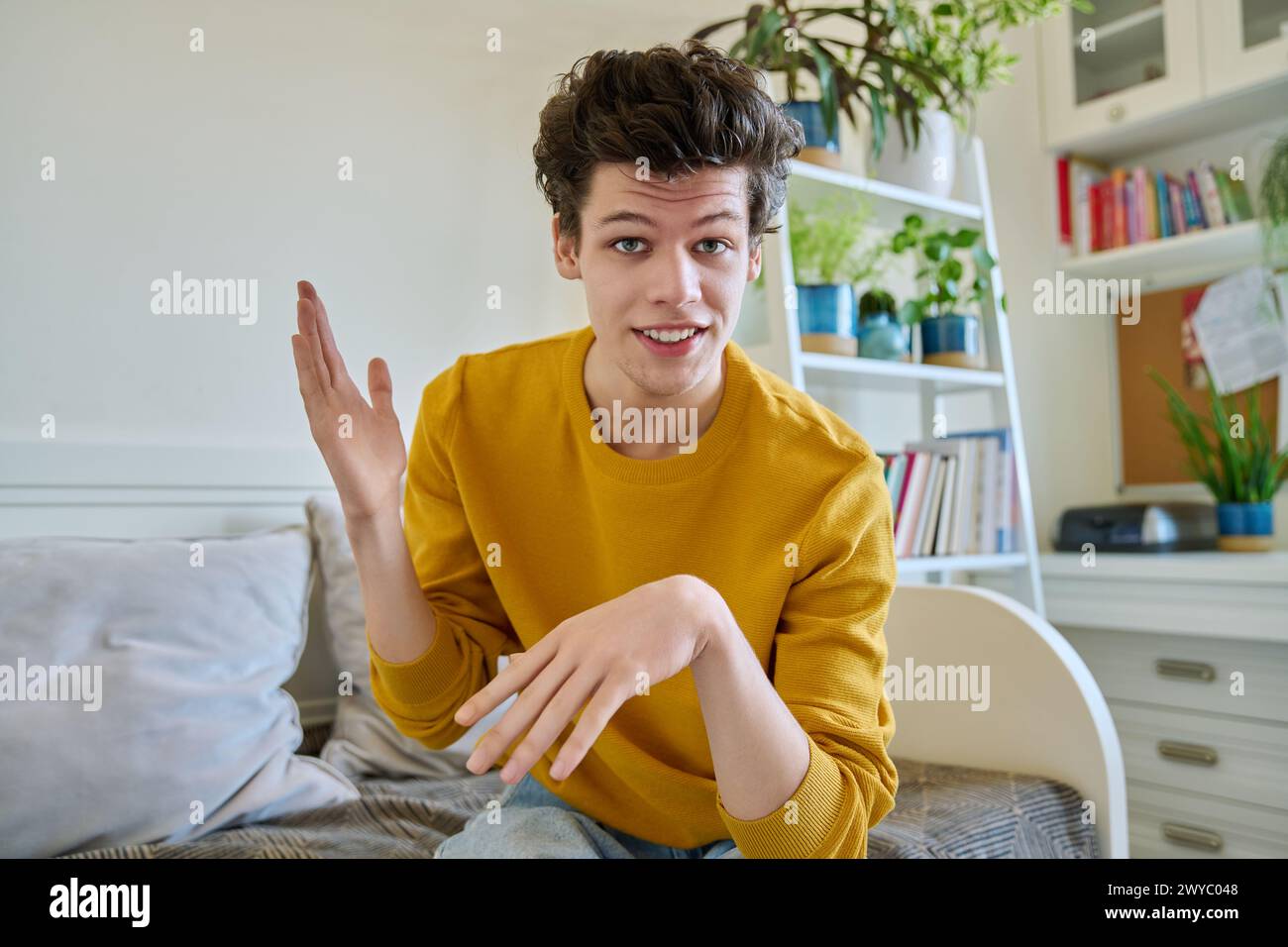 Web camera view of young guy 19-20 years old talking looking at camera ...