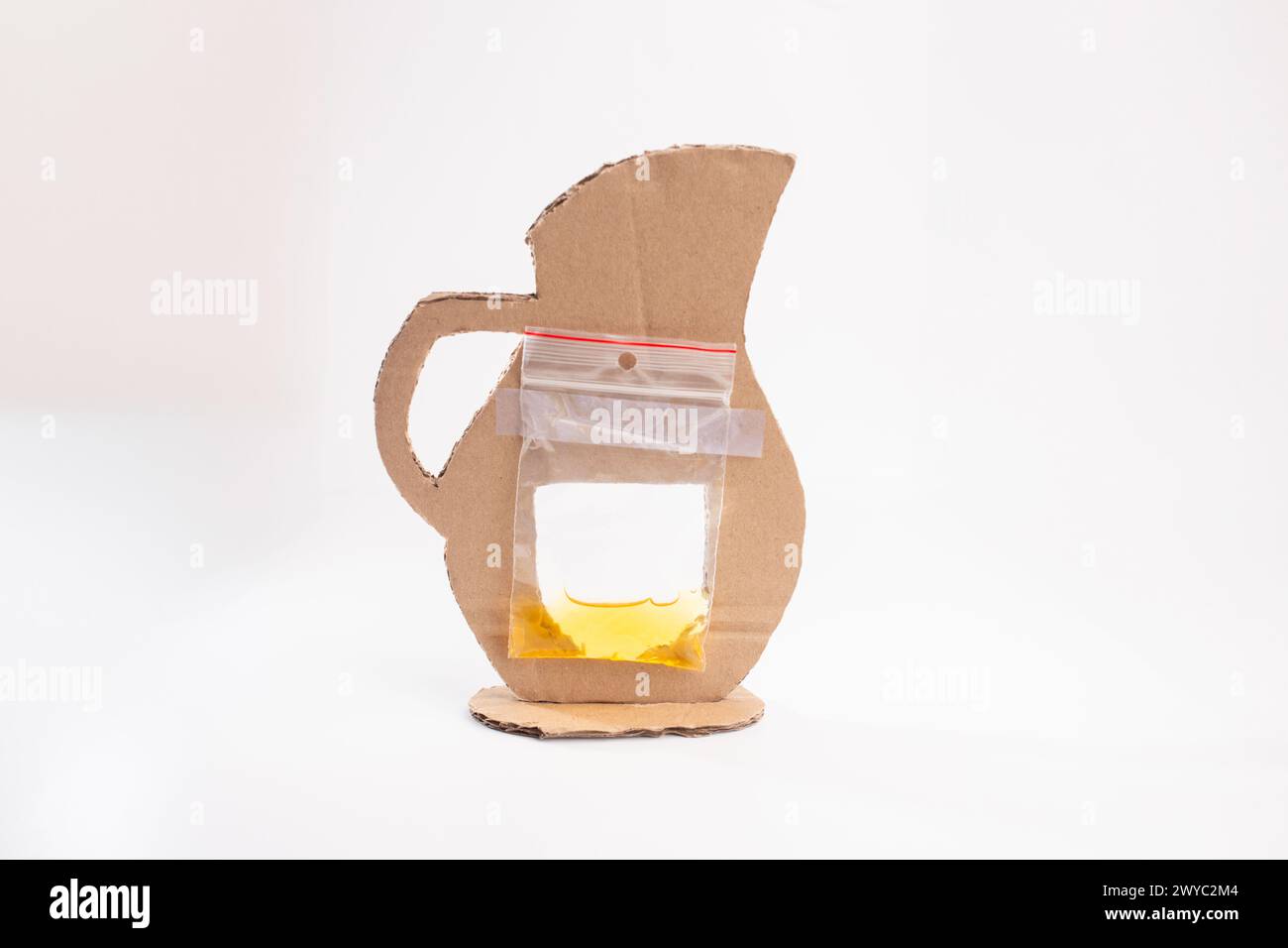 Crafting with cardboard: plastic bag and cutout pitcher assembly, front ...