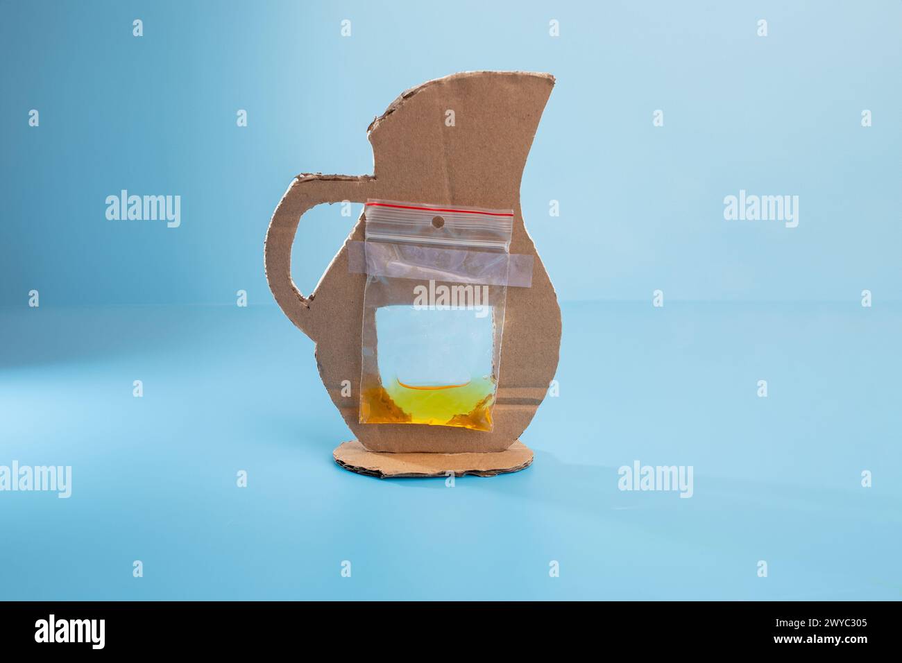 Plastic bag attached to cardboard cutout, pitcher craft concept Stock ...
