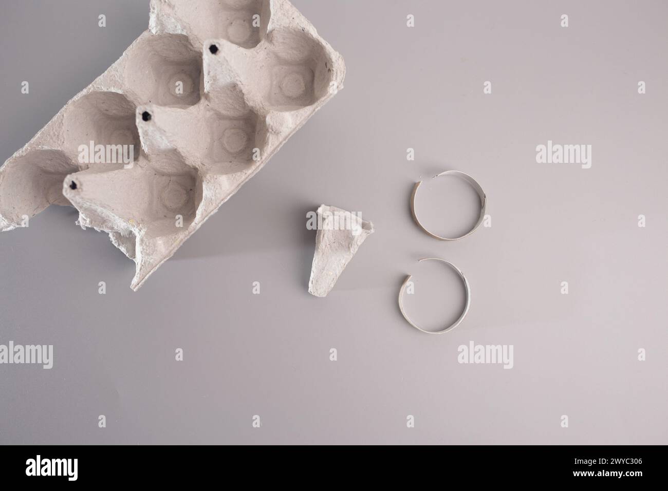 empty carton from eggs sitting on top of a table, minimalism, hoop out ...