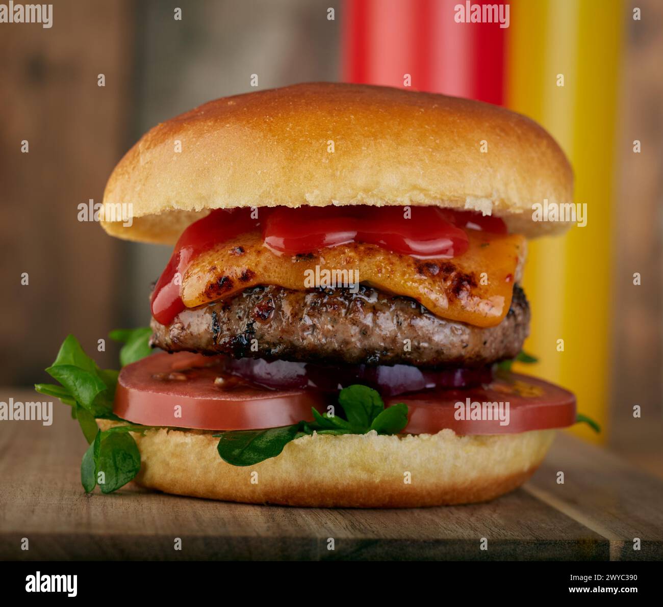 Juicy stacked cheese burger in a brioche bun Stock Photo - Alamy