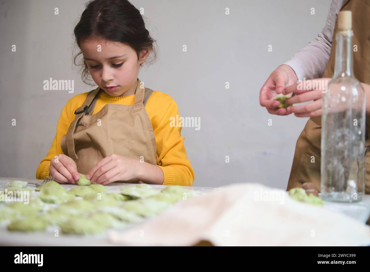Children learn making dumplings during a cooking class. Preparing ...
