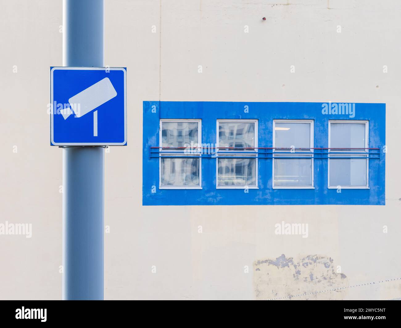 A Toll Road camera, indicated by a nearby sign, is mounted on a tall ...