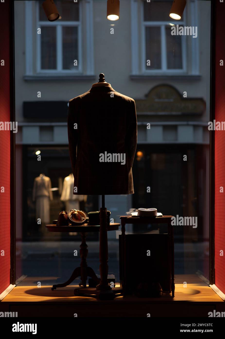 A mannequin silhouette in a small shop window Stock Photo - Alamy