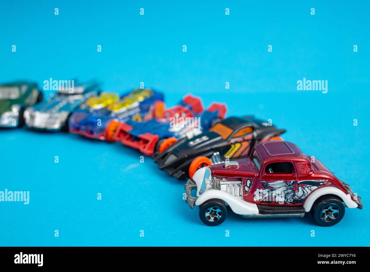 Multiple classic metallic toy cars on blue background, soft focus Stock ...
