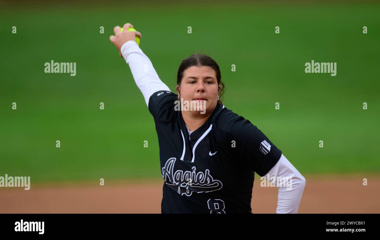 Utah St. pitcher Jessica Stewart (8) begins her wind up to throw the ...