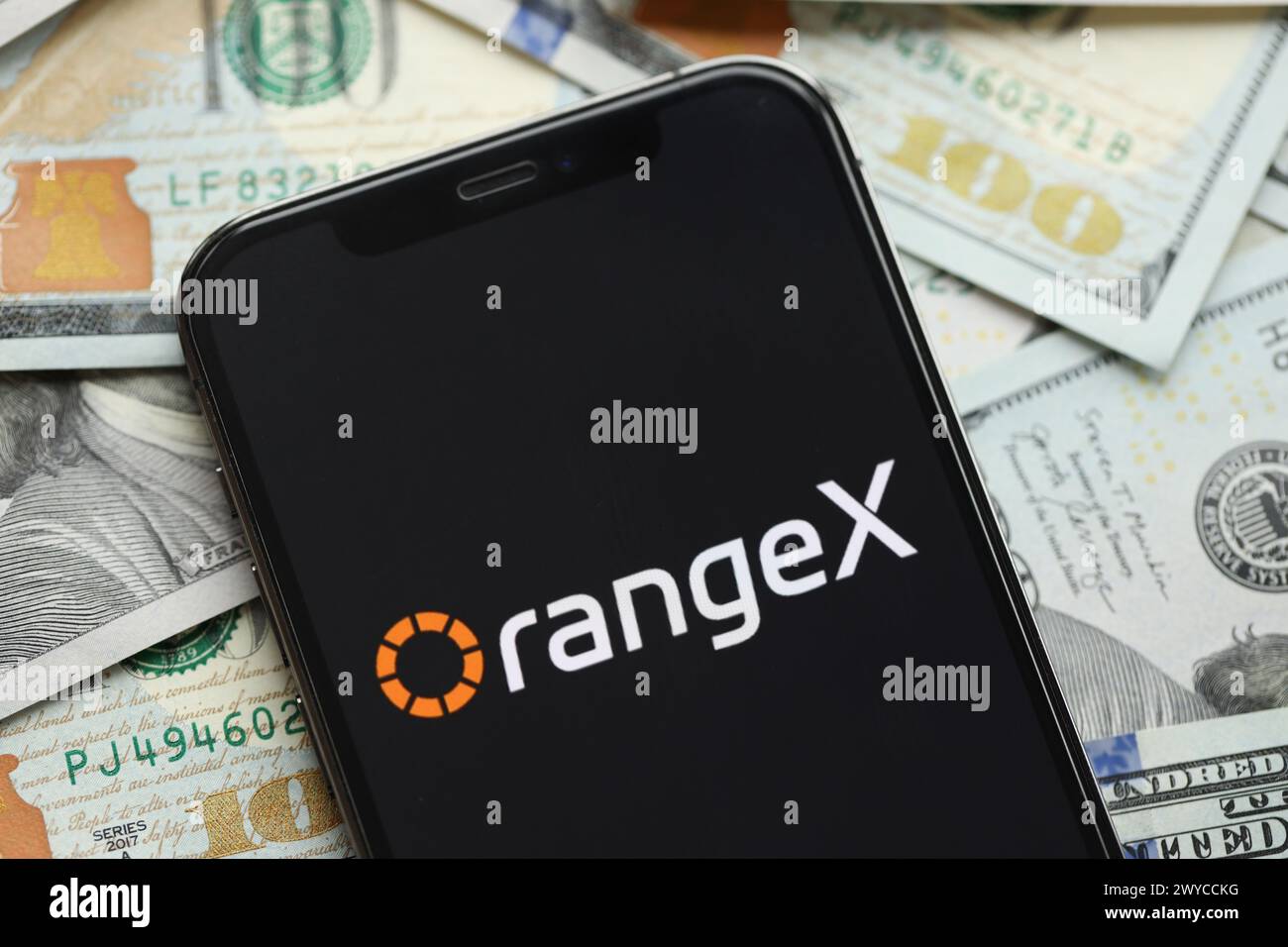 KYIV, UKRAINE - MARCH 15, 2024 OrangeX logo on iPhone display screen ...