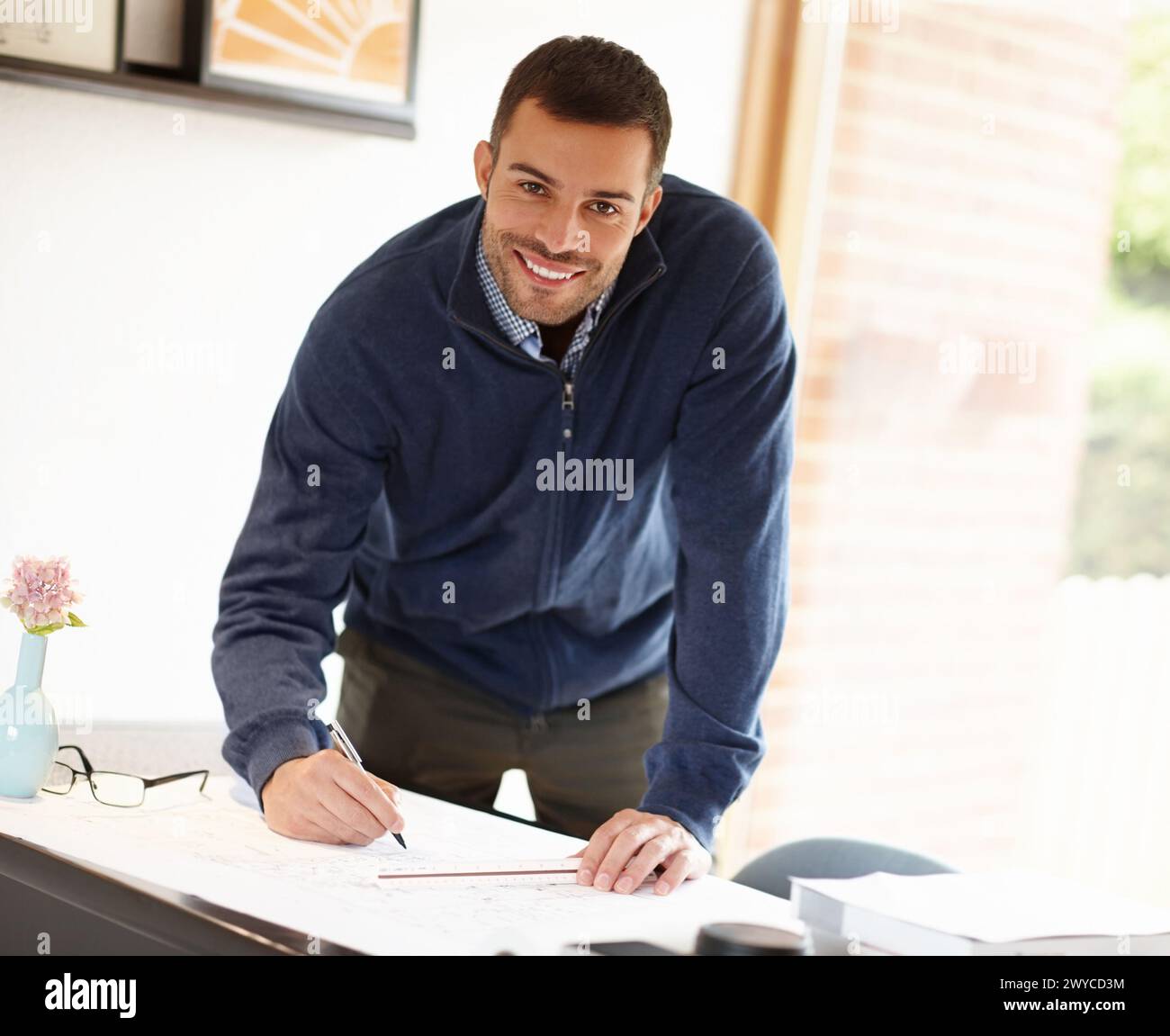 Man, portrait and architect with plan for design in office, documents ...