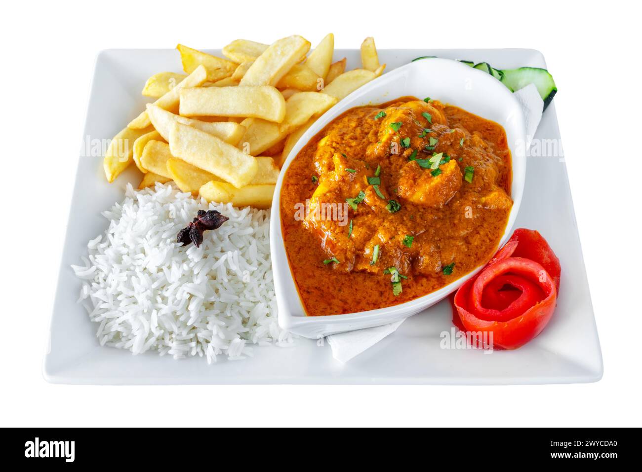 Asian chicken curry with rice and vegetables sauteed and seasoned. On a ...