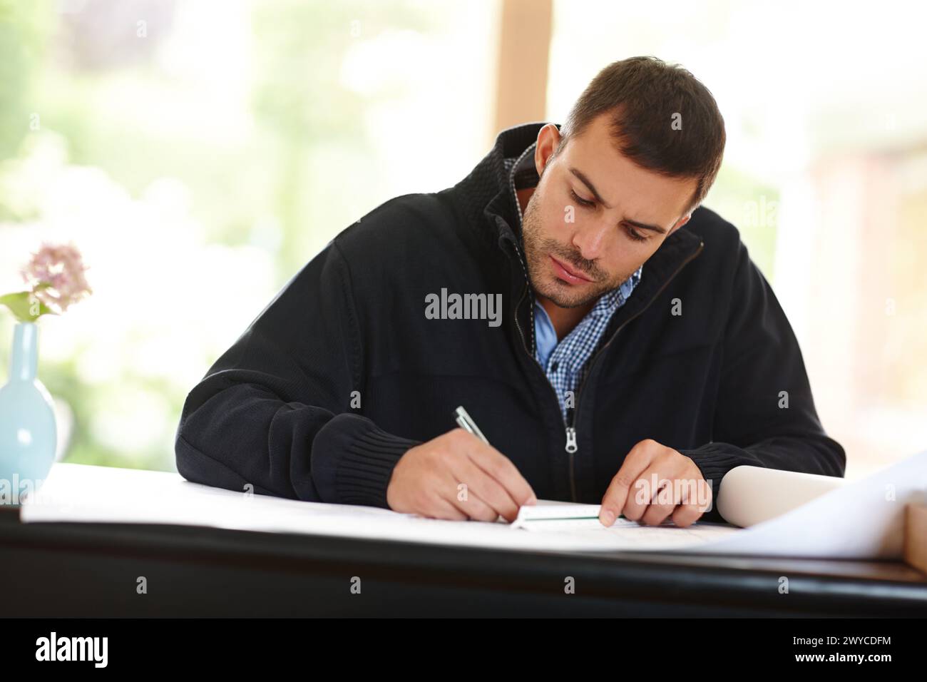 Man, drawing and architect with plan for design in office, documents ...